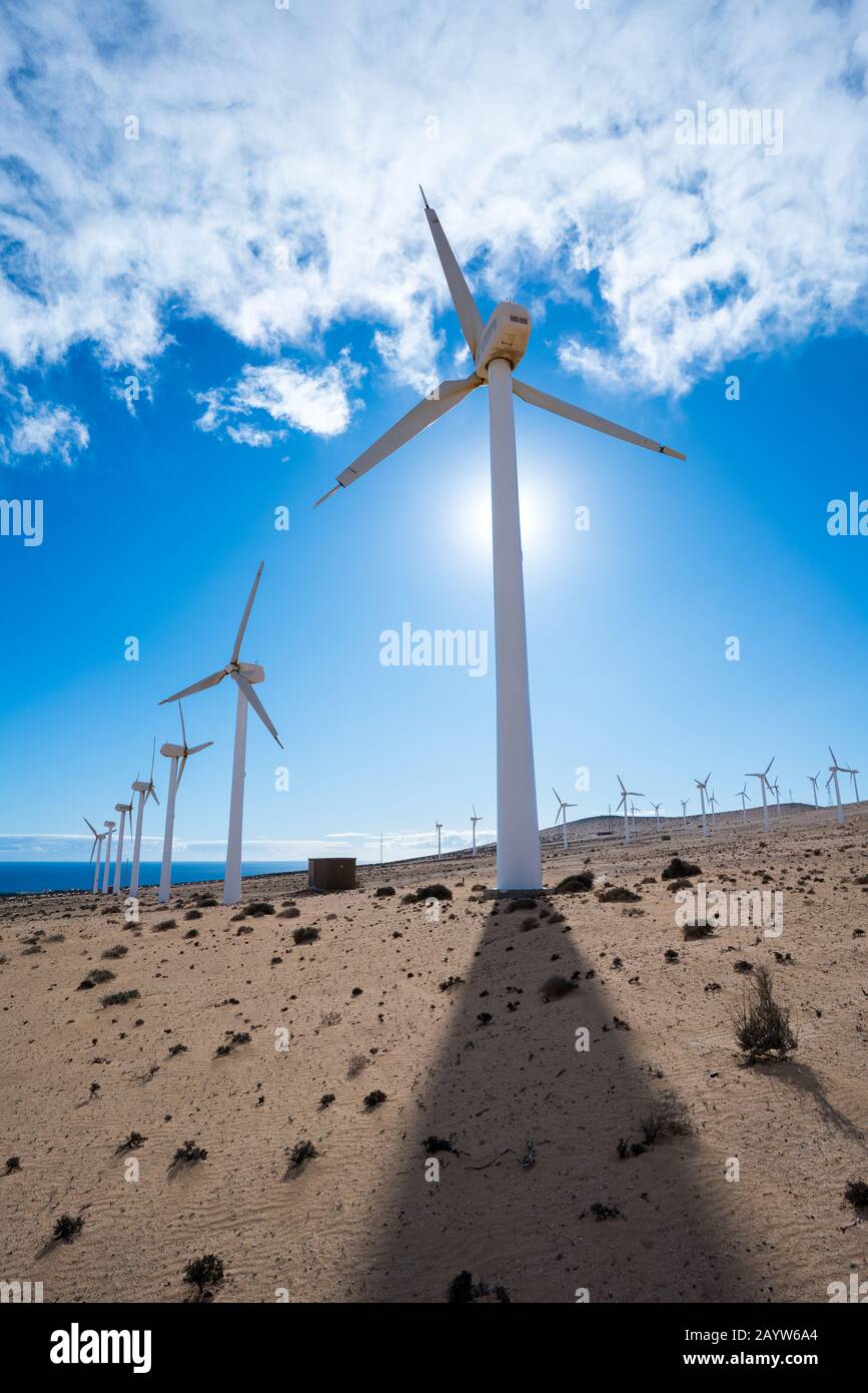 wind turbine in the desert with blue sky background. wind mill farm in ...