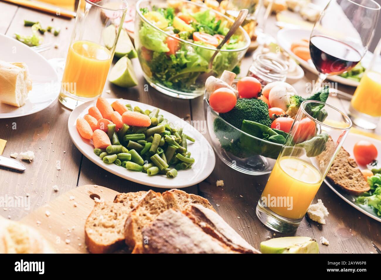 Vegetables and healthy food with glasses of drinks on table Stock Photo ...
