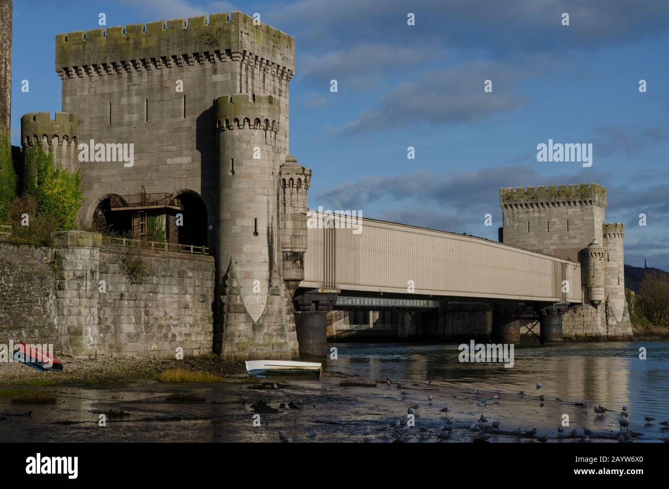 The metal box railway bridge at the side of Conwy Castle crosses the ...
