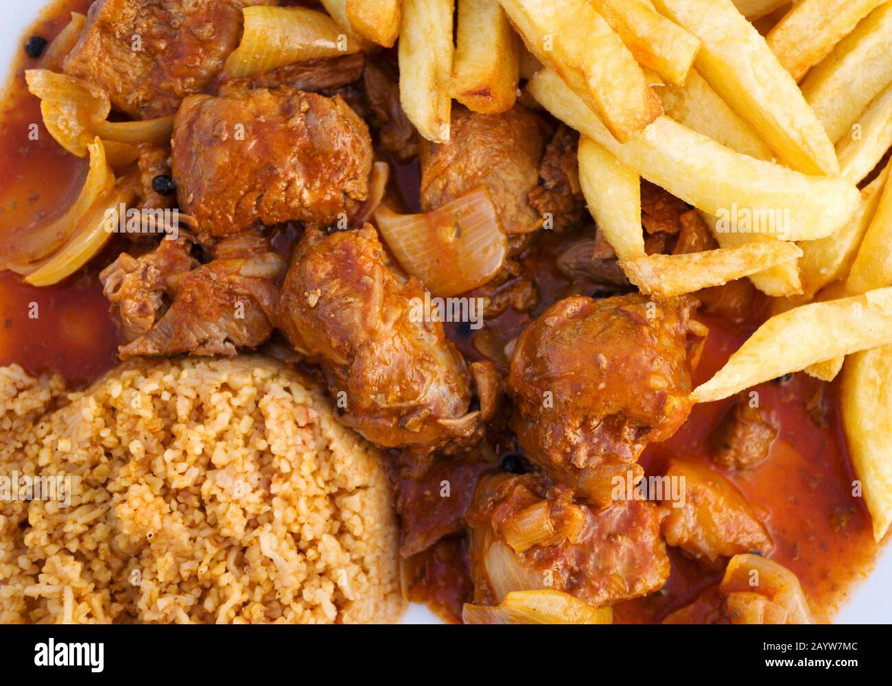 Traditional Greek Beef Stifado with rice and french fries Stock Photo ...