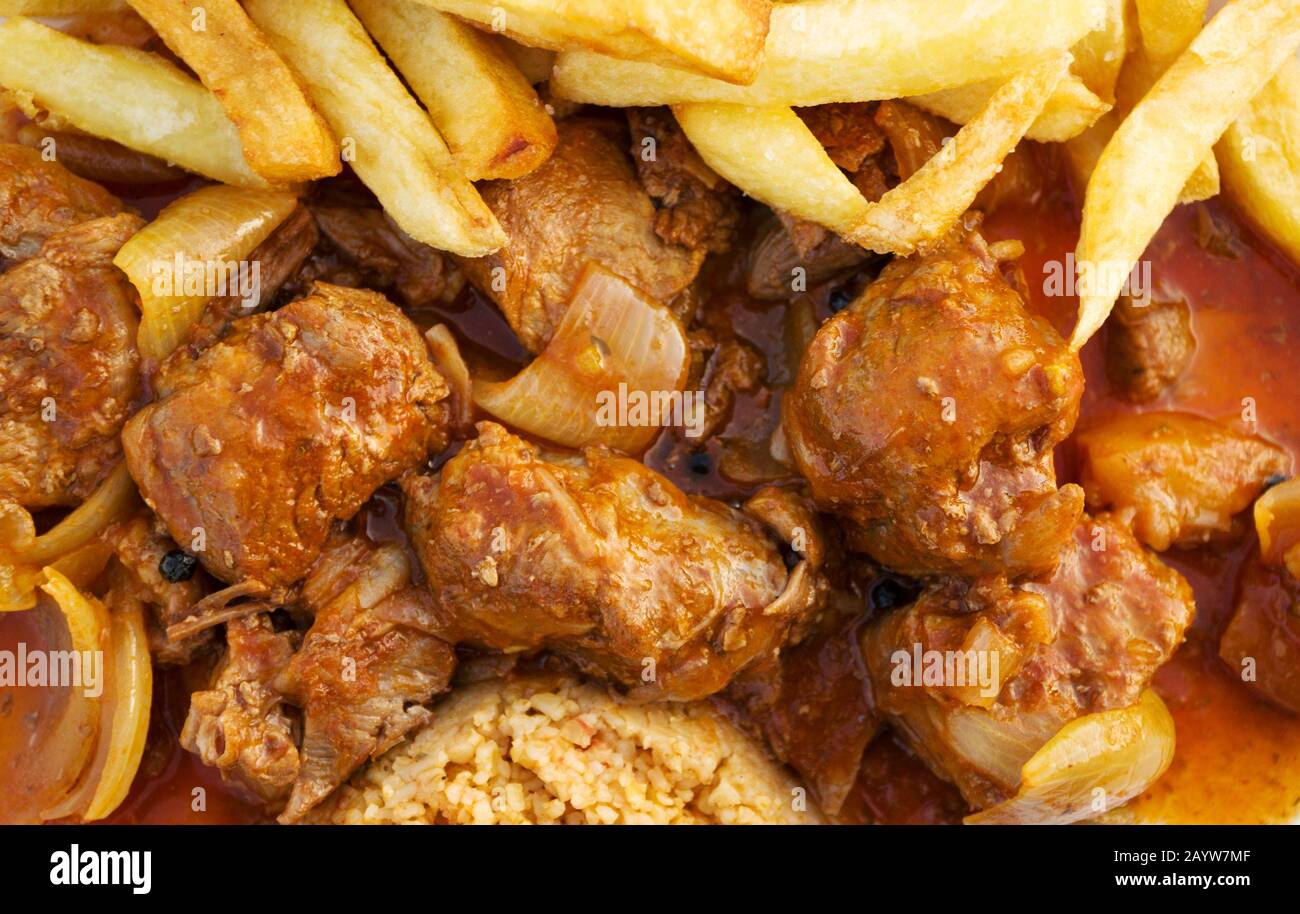Traditional Greek Beef Stifado with rice and french fries Stock Photo ...
