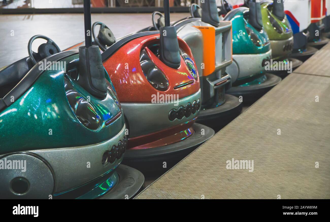 Bumper cars in the city amusement park at evening Stock Photo - Alamy