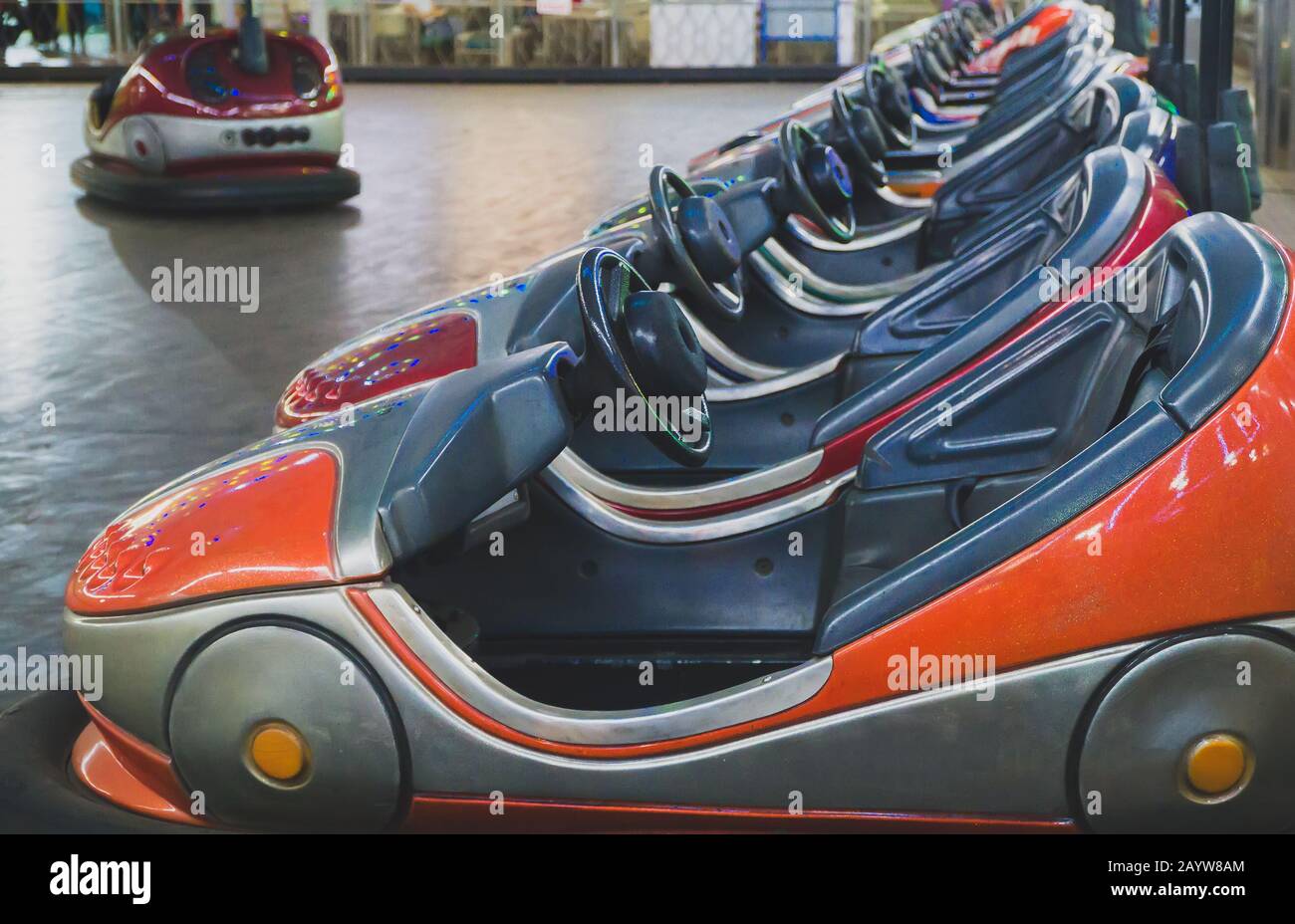 Bumper cars in the city amusement park at evening Stock Photo - Alamy