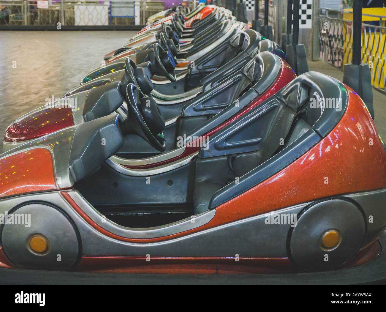 Bumper cars in the city amusement park at evening Stock Photo - Alamy