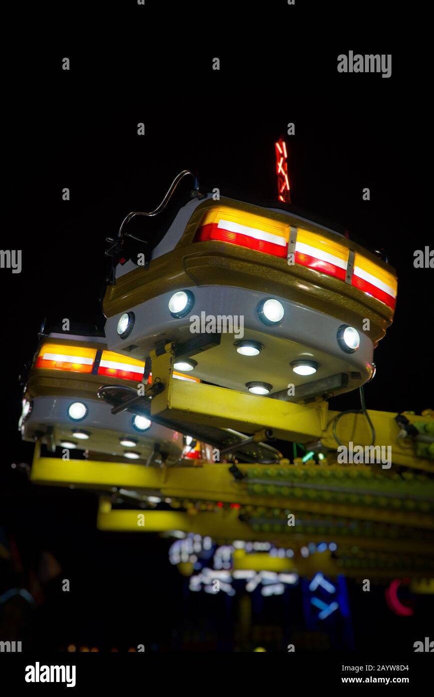 Hurricane ride in the city amusement park at evening Stock Photo - Alamy