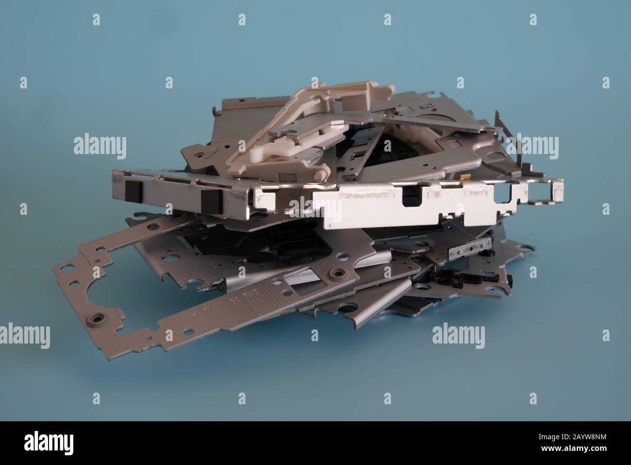 Old disassembled computer DVD drive for recycle on blue background ...