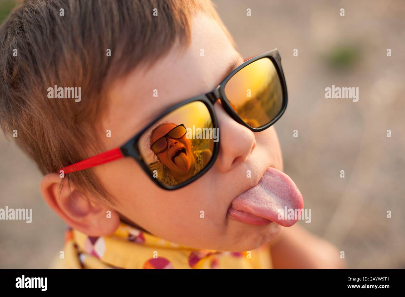 relation concept of little kids tease and stick tongue each other Stock ...