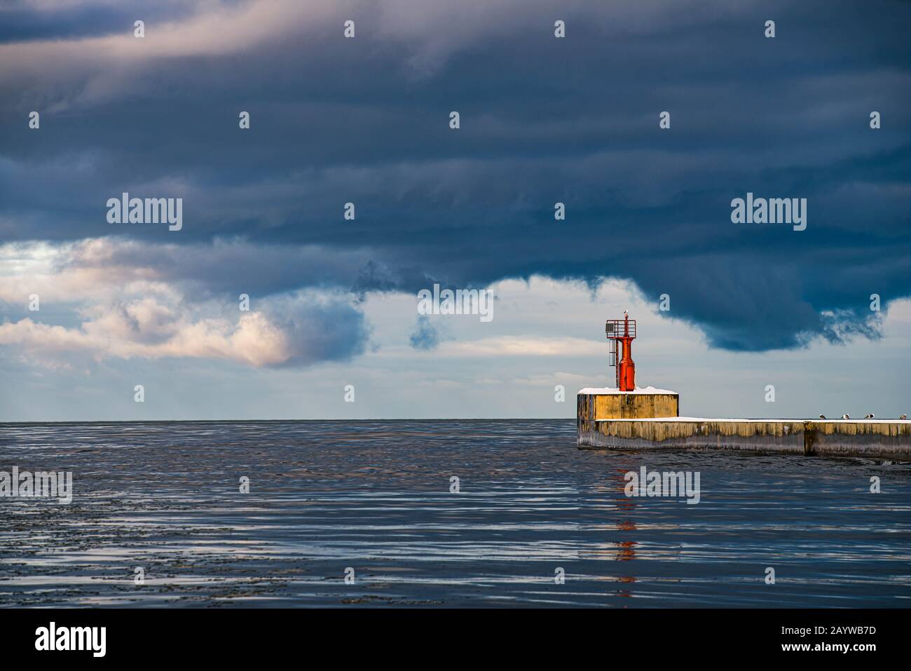 Orange port lighthouse. The gate of the port in Liepaja, Latvia. Pier ...