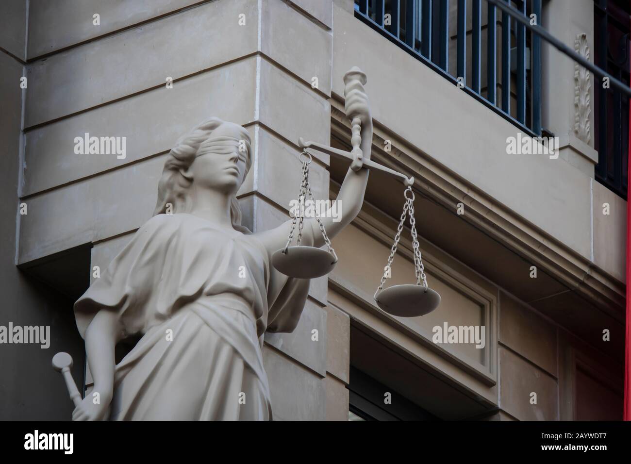 The statue of justice with a scales and a sword in his hand was carved ...