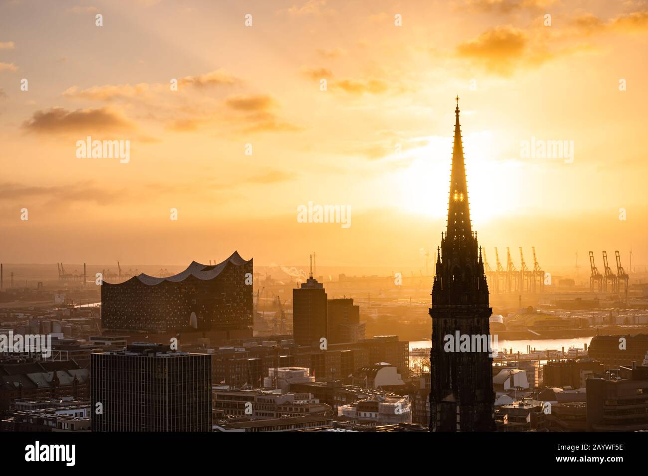 The sun shines through the church tower of St. Nikolai church in the ...