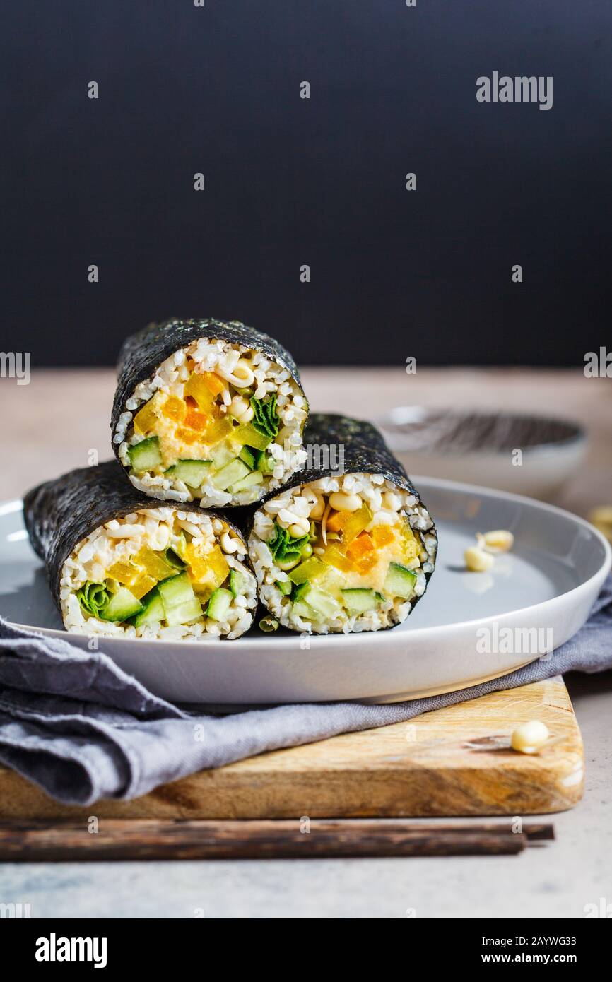 Vegan nori wraps with rice, vegetables and seedlings Stock Photo - Alamy
