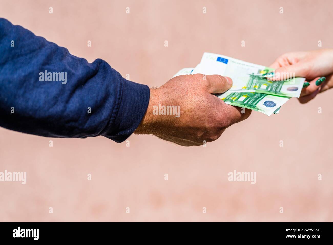 Hand giving money like bribe or tips or salary isolated, hard worked ...