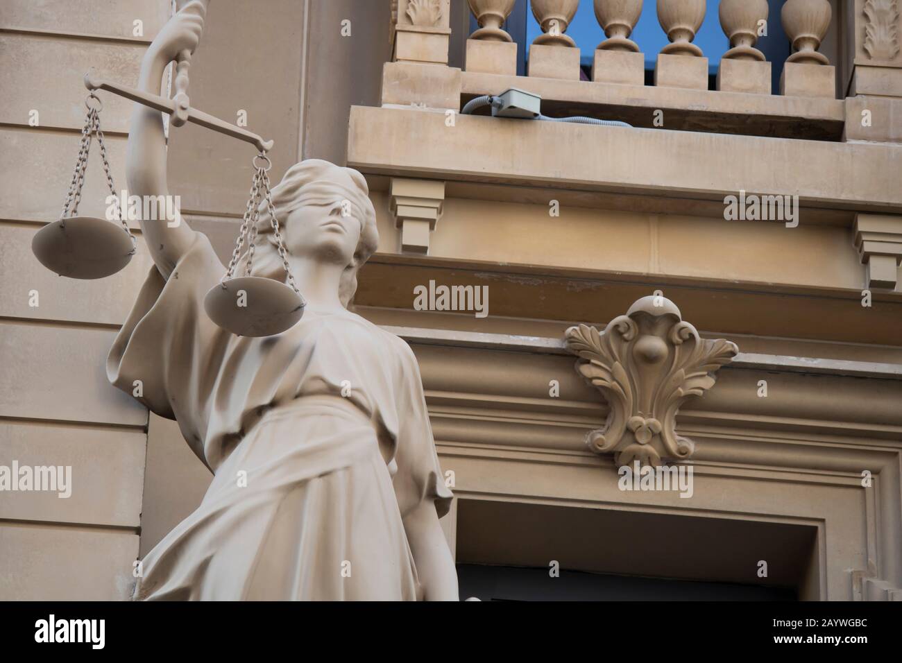 The statue of justice with a scales and a sword in his hand was carved ...