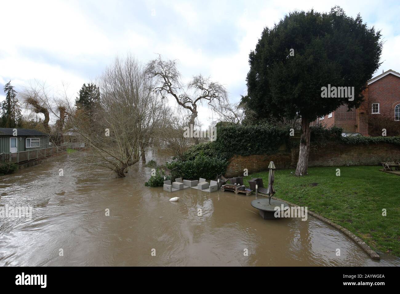 Water from the River Wey floods a garden in Send, Surrey, in the ...
