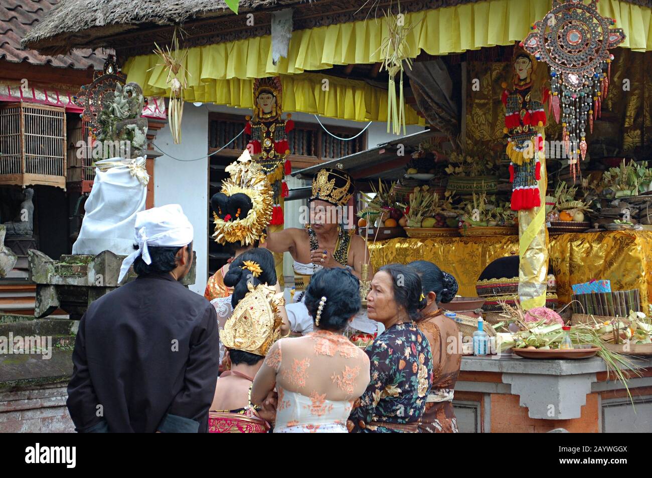A Balinese Hindu priest gives blessing to a bride in a traditional Balinese wedding ceremony ...