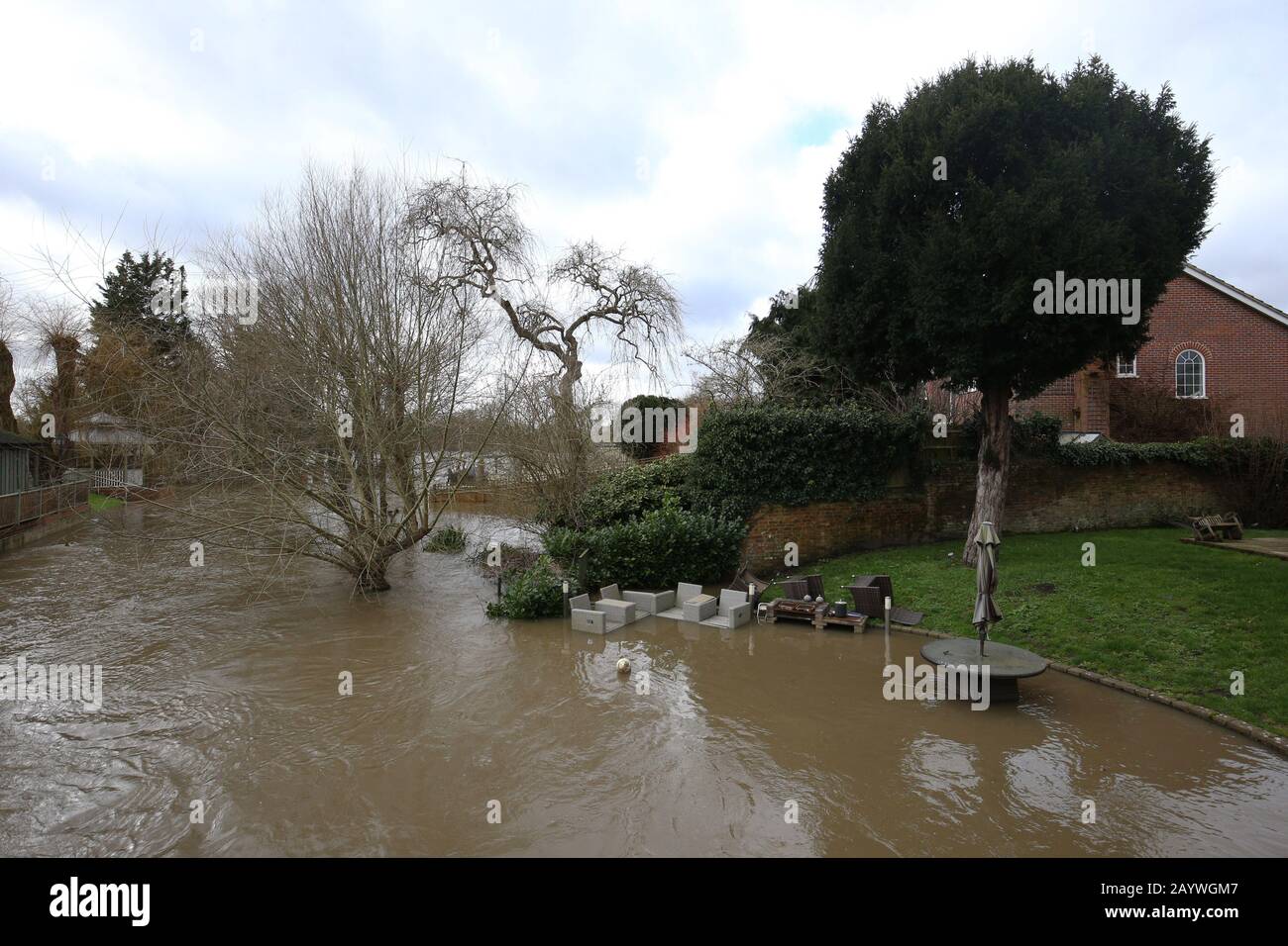 Water from the River Wey floods a garden in Send, Surrey, in the ...