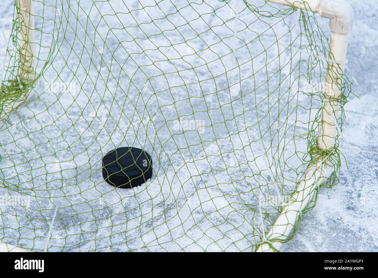 Puck in the net hi-res stock photography and images - Alamy