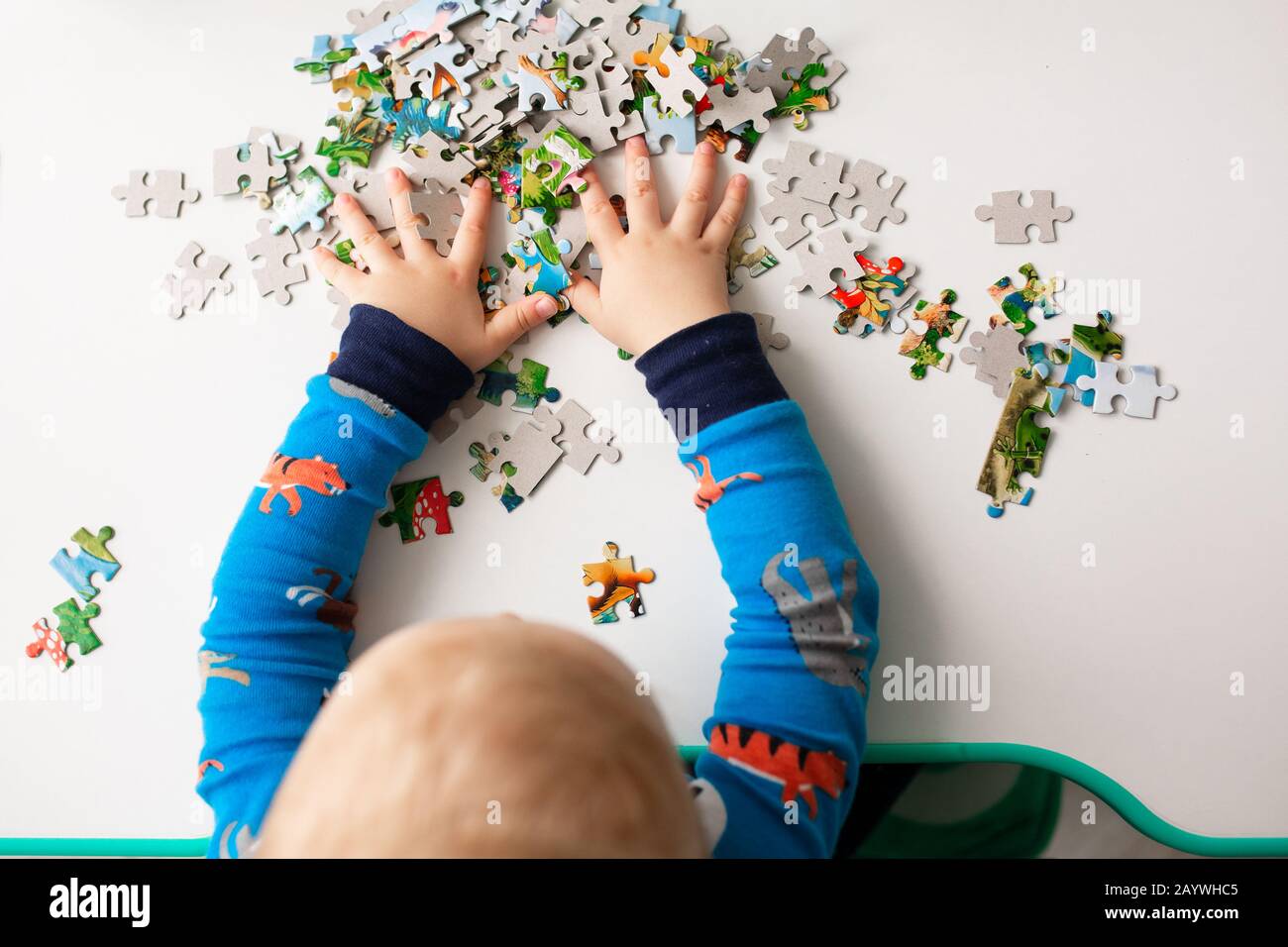 Boy solving jigsaw puzzle on hi-res stock photography and images - Alamy