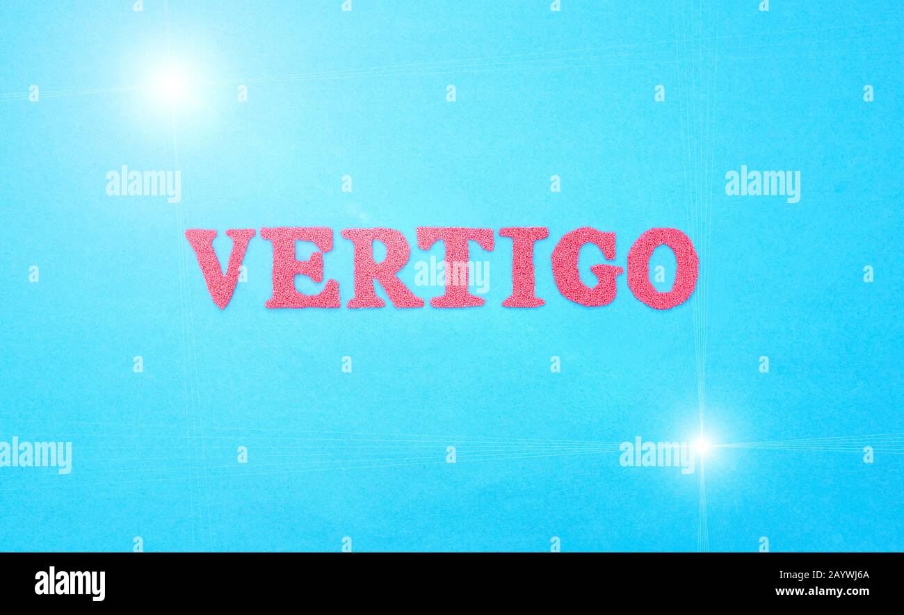 Word vertigo in red letters on a blue background. The concept of ...