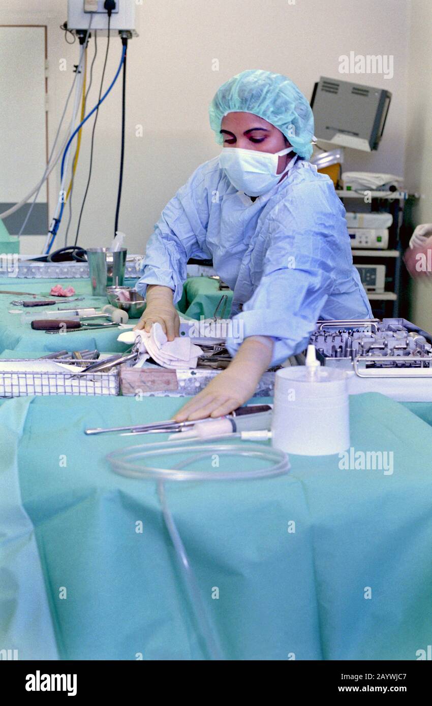 a scrub nurse preparing the sterile surgical instruments Stock Photo ...