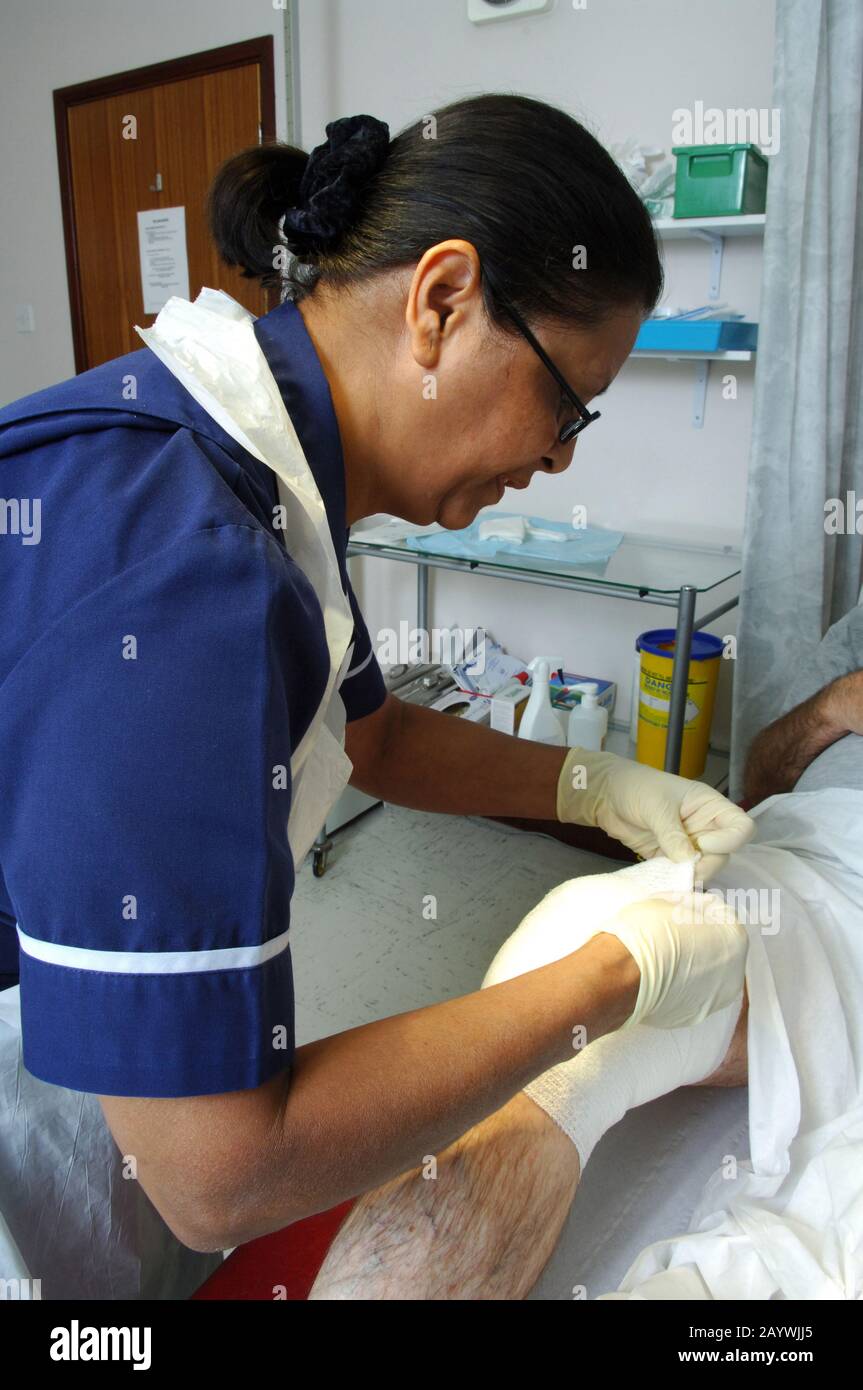 Nurse & Knee Dressing Stock Photo - Alamy