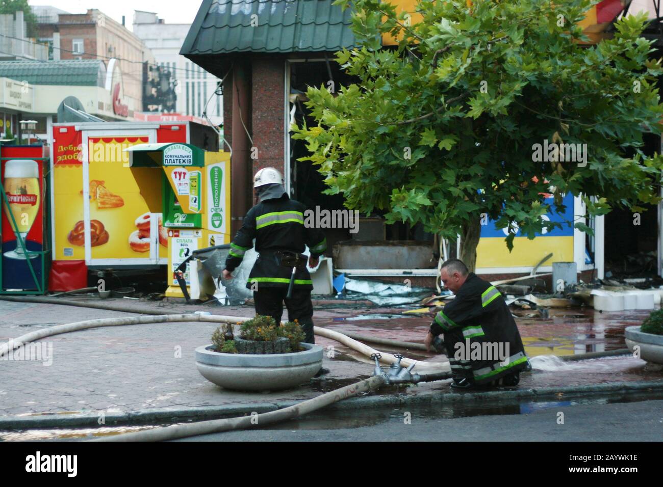 At the scene of a fire in a building. Firefighters Work Concept Stock ...