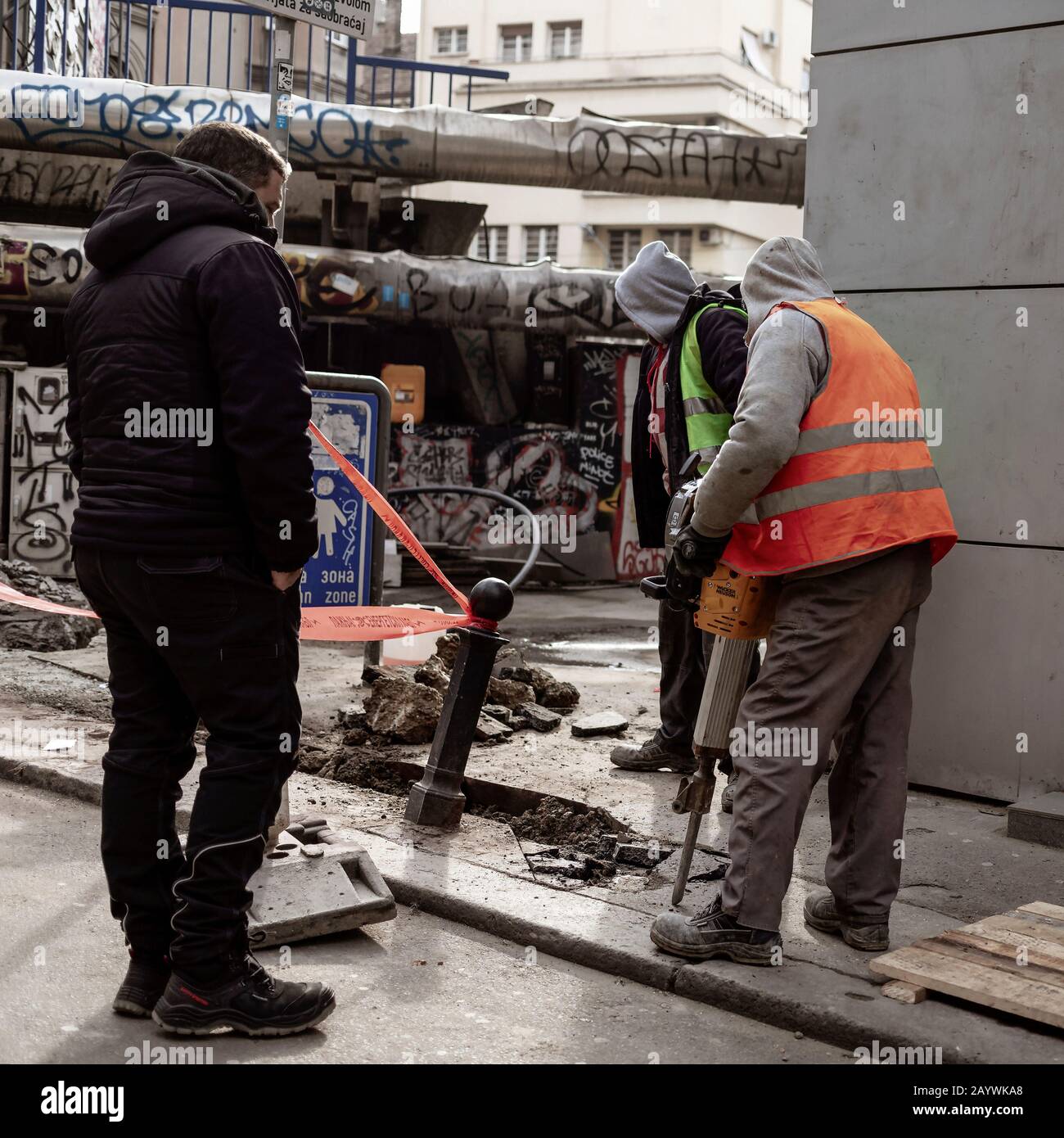 Belgrade, Serbia, Feb 7, 2020: Construction workers drilling and ...