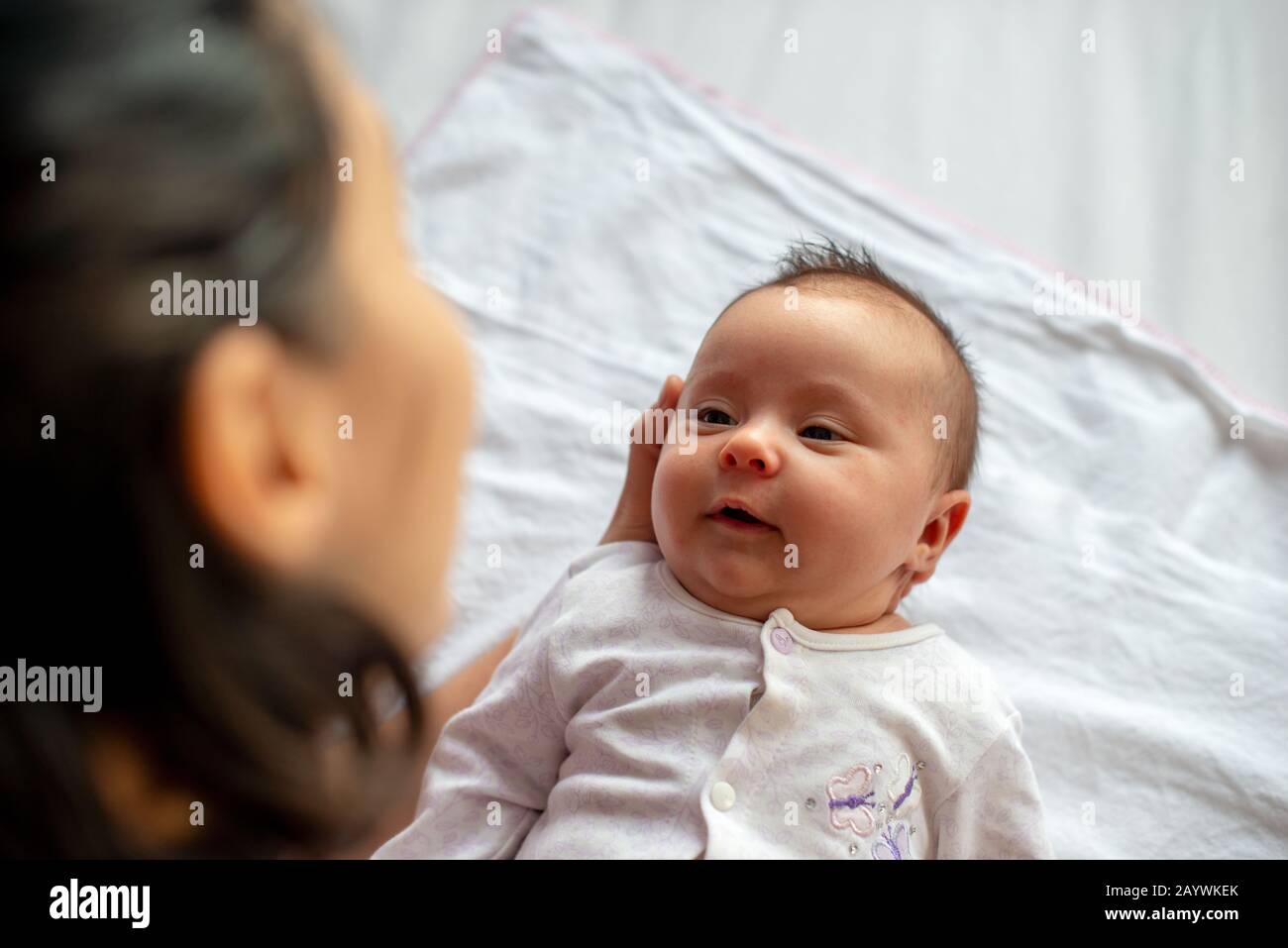 Baby in mothers arms hi-res stock photography and images - Alamy