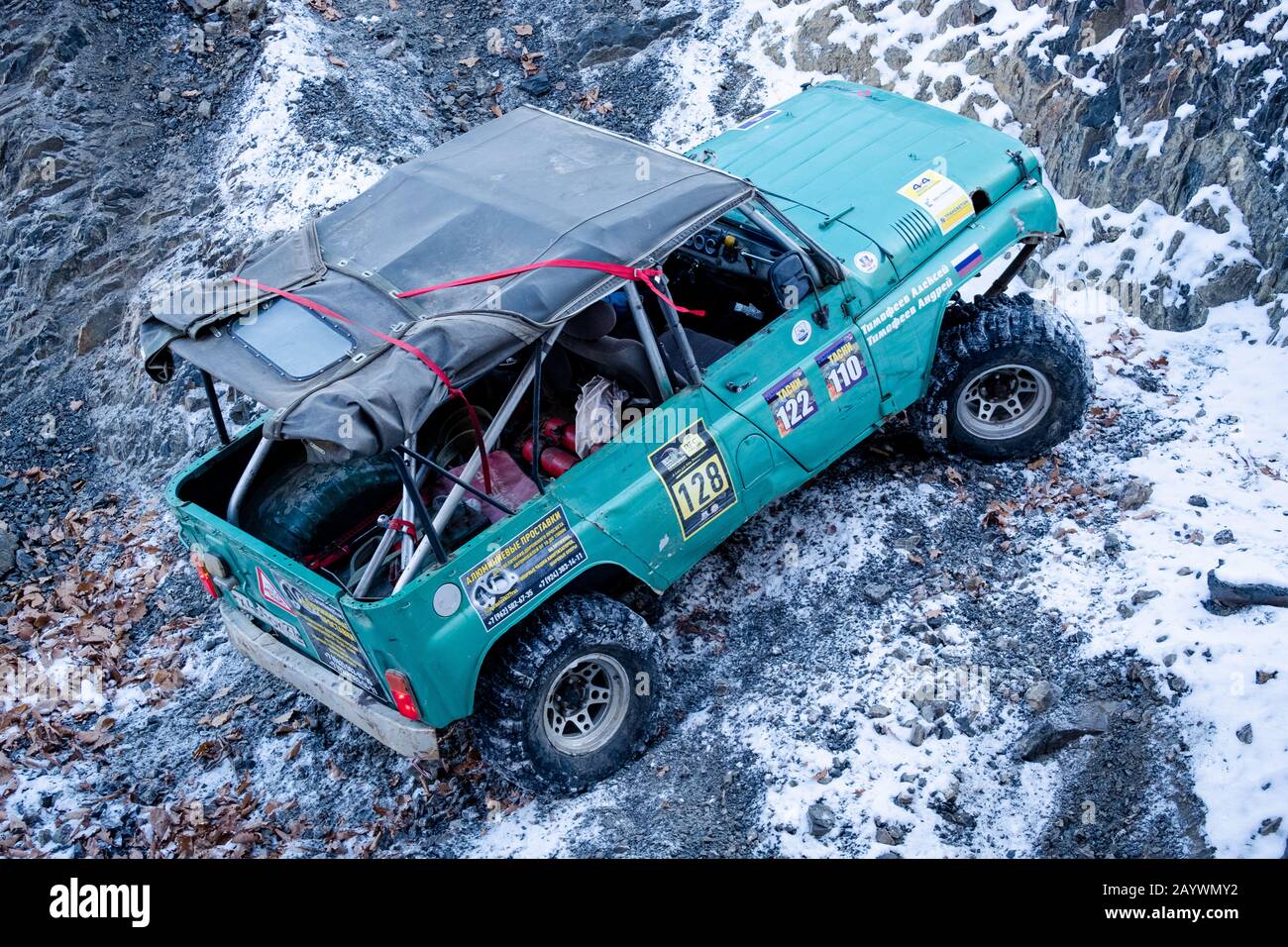 Jeep Suzuki Jimny overcomes obstacles in the forest Stock Photo - Alamy