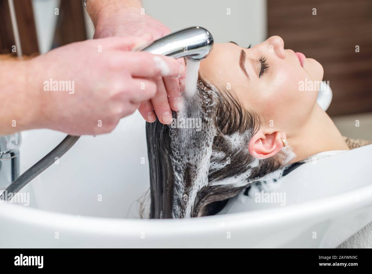 Hands washing woman's hair in sink at beauty salon, close up Stock ...