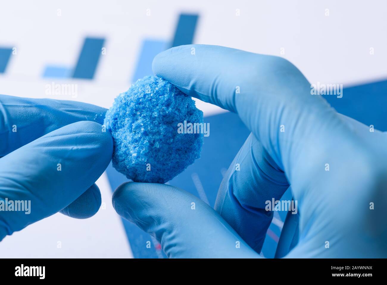 Scientist hold big blue chemical crystal in laboratory Stock Photo - Alamy