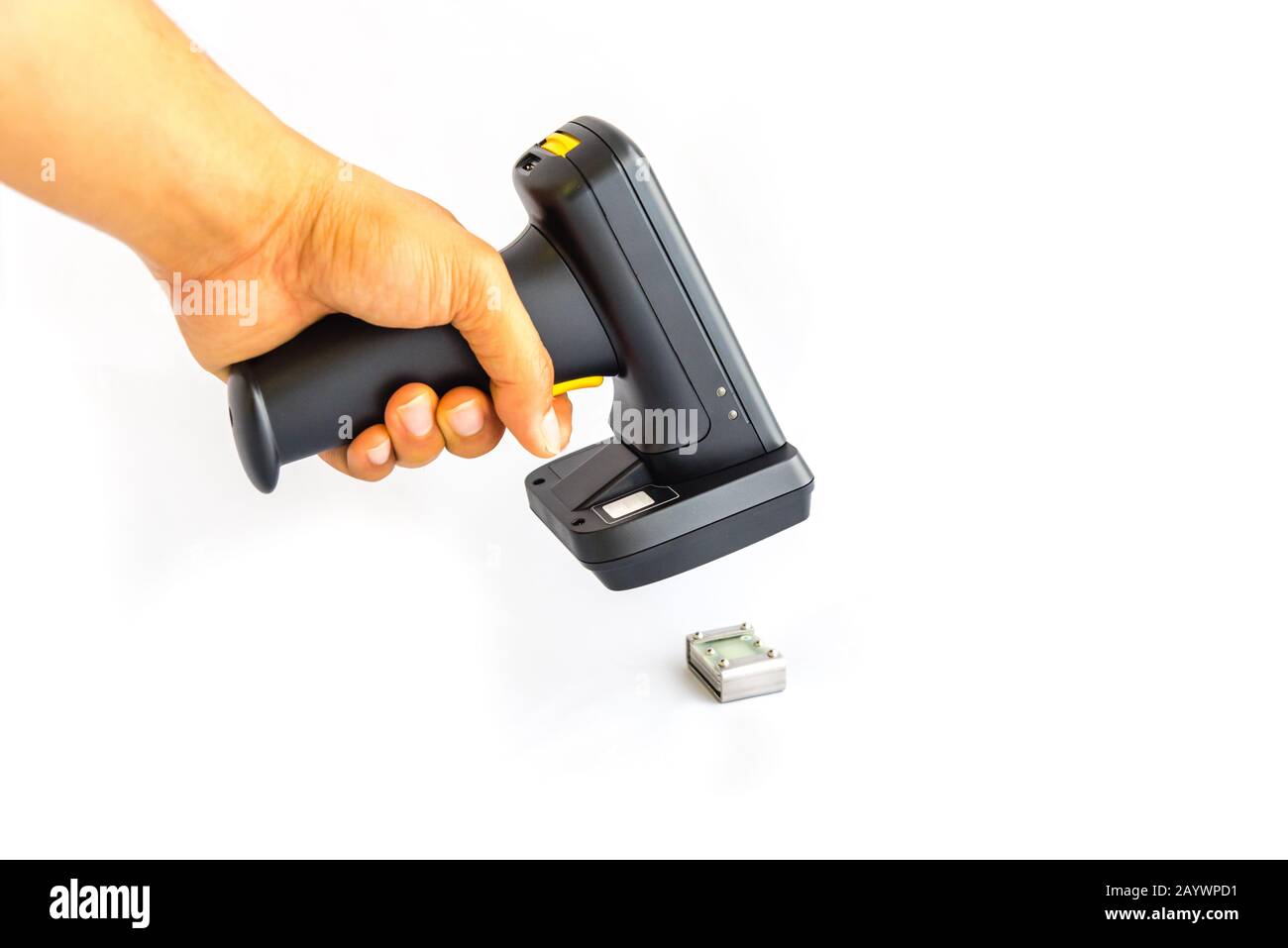 Male hand using barcode reader to scan metal RFID tag isolated on white ...