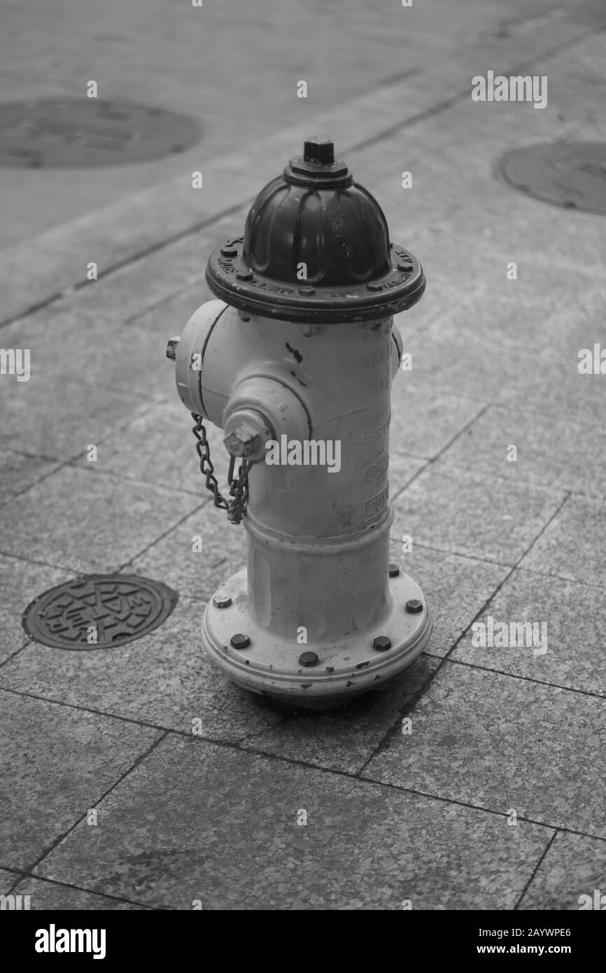 Fire hydrant on a city sidewalk Stock Photo - Alamy