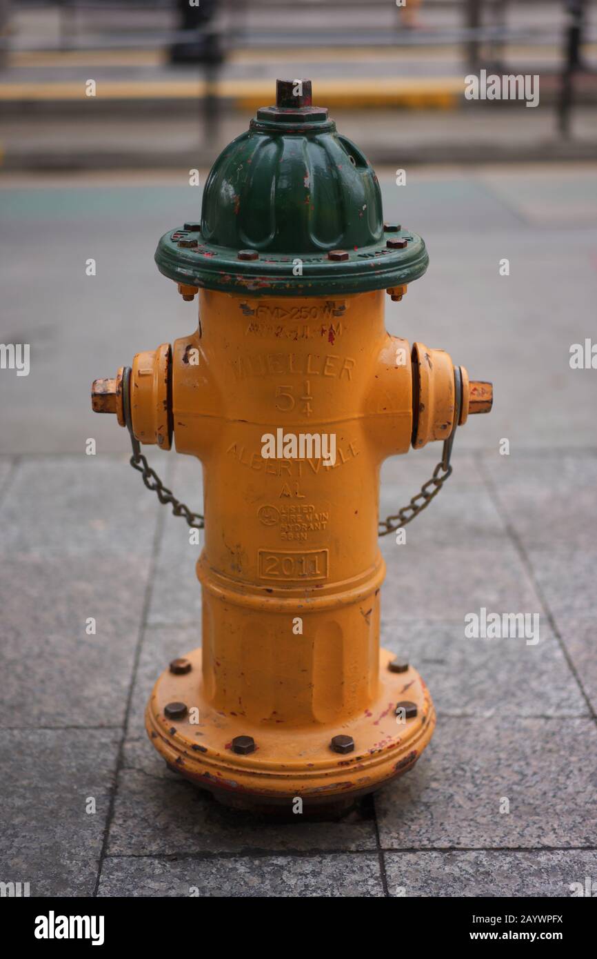 Fire hydrant on a city sidewalk Stock Photo - Alamy