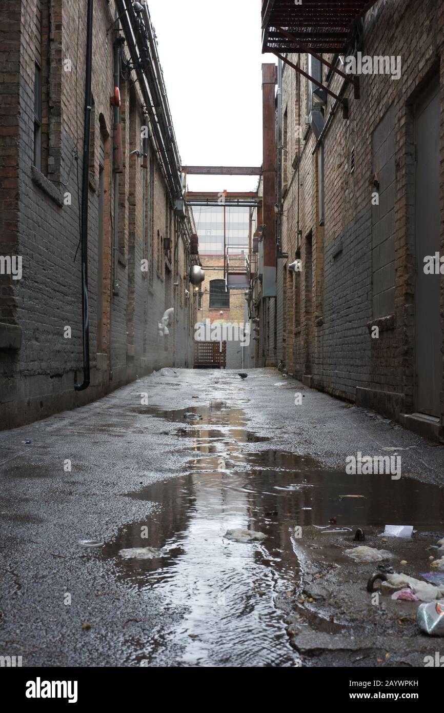 Street alley in the city on a rainy day Stock Photo - Alamy