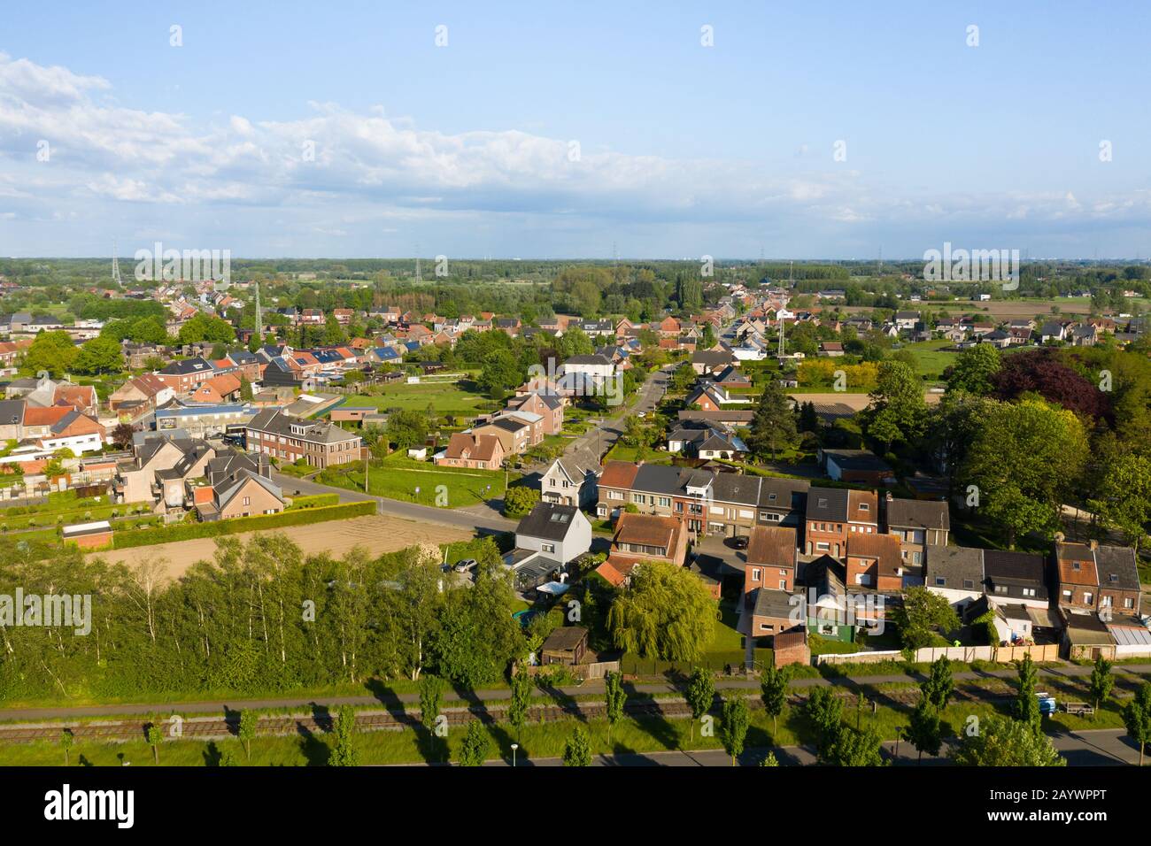 Streets and a railway crossing the flemish town of Sint-Amands; aerial ...