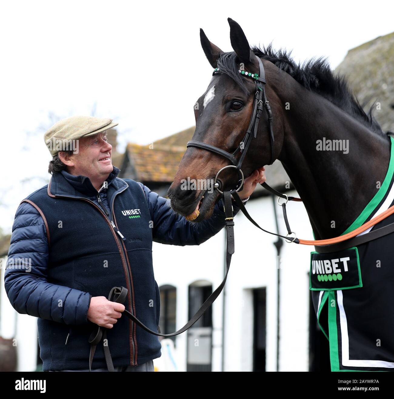 Trainer Nicky Henderson poses for a photo with Altior during a visit to ...