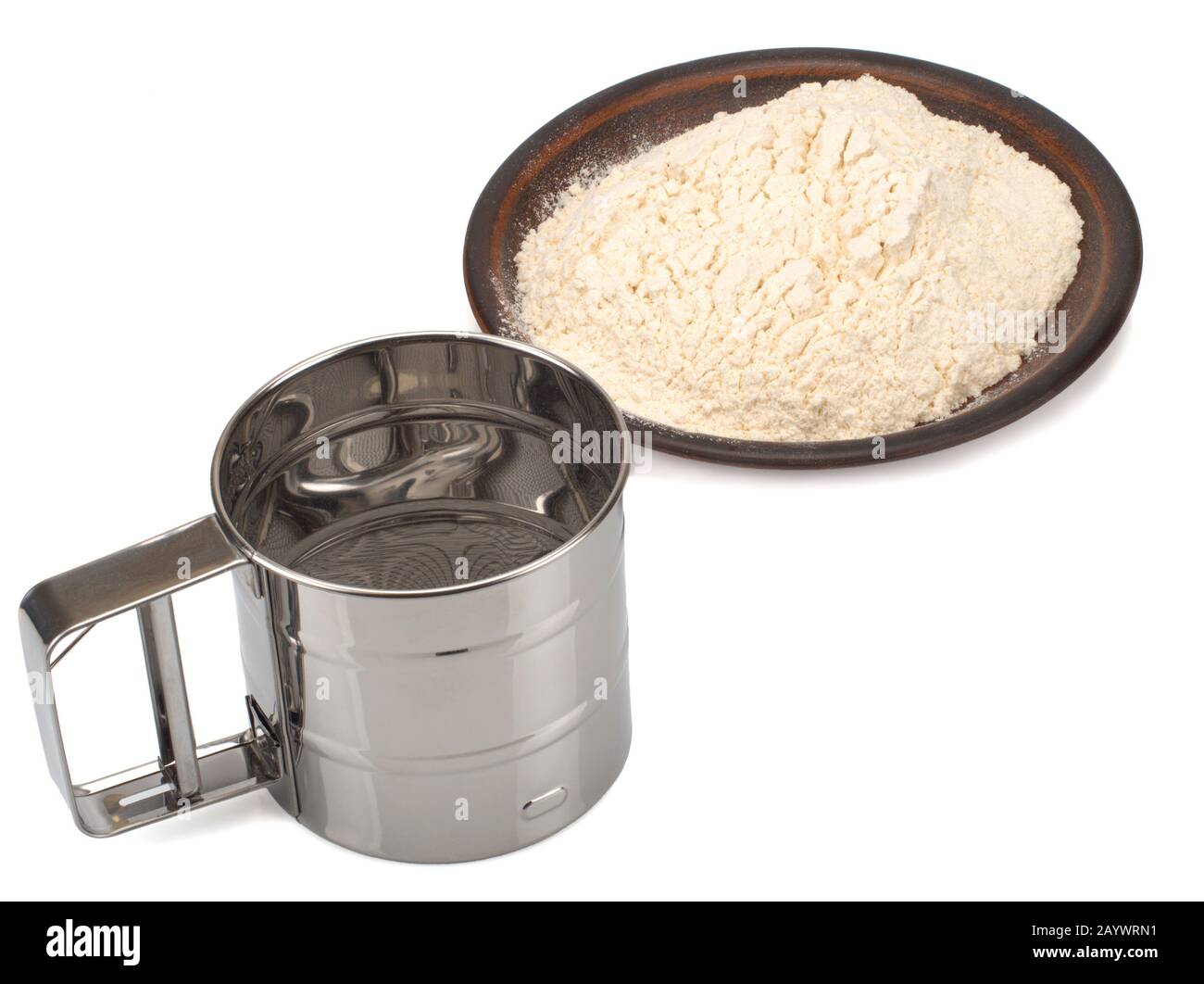 Metal flour sifter and flour in plate Isolated on white background ...