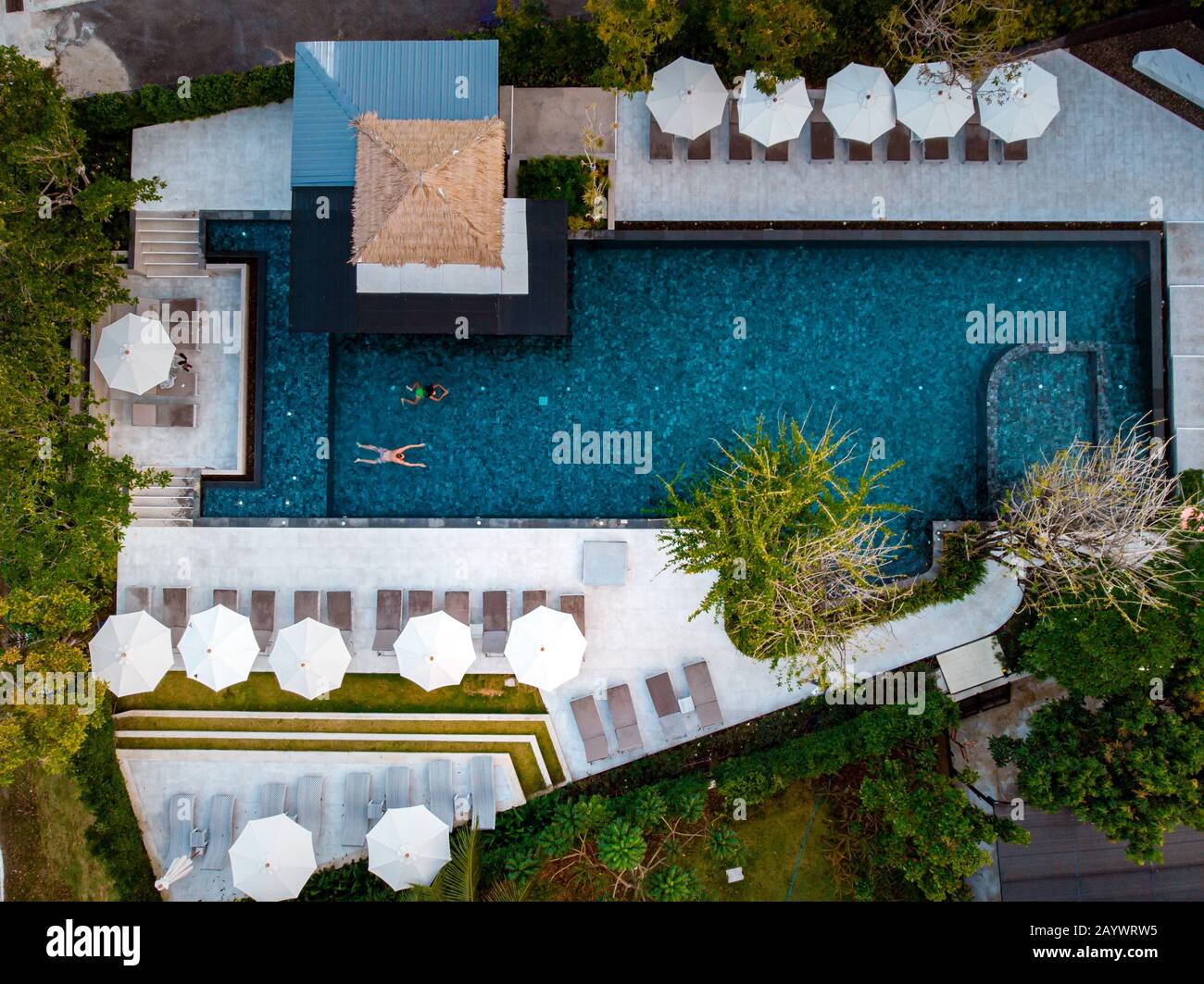 top view swimming pool, drone view pool, couple in swimming pool during ...