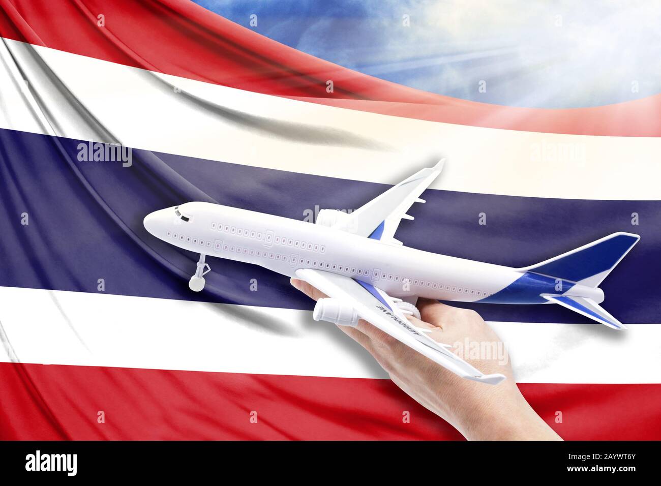 Airplane in hand with national flag of Costa Rica on a background of ...