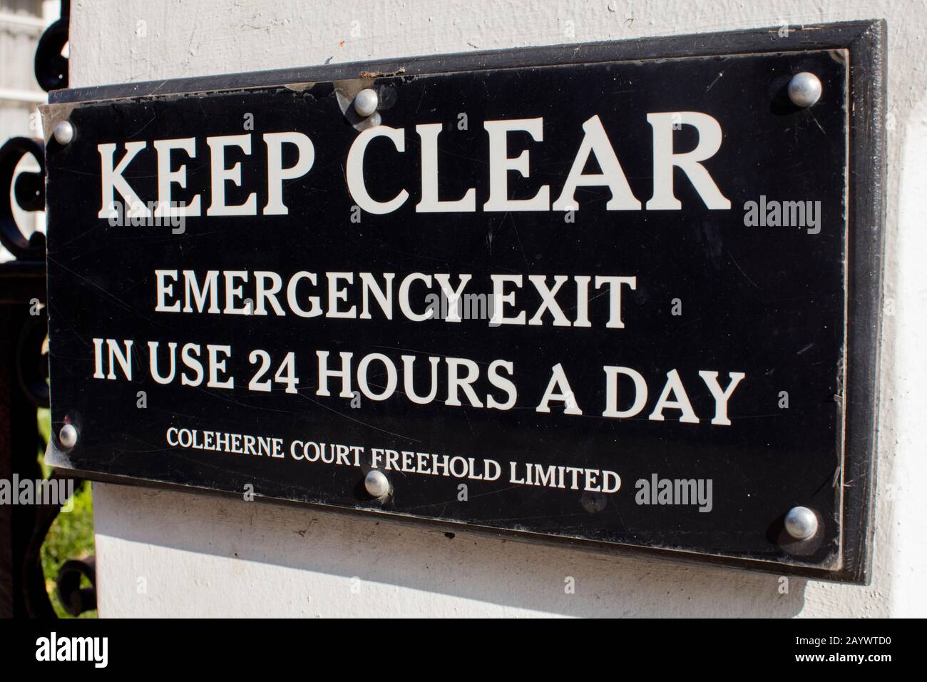 Warning notice on gate of Coleherne Court gardens indicating emergency ...