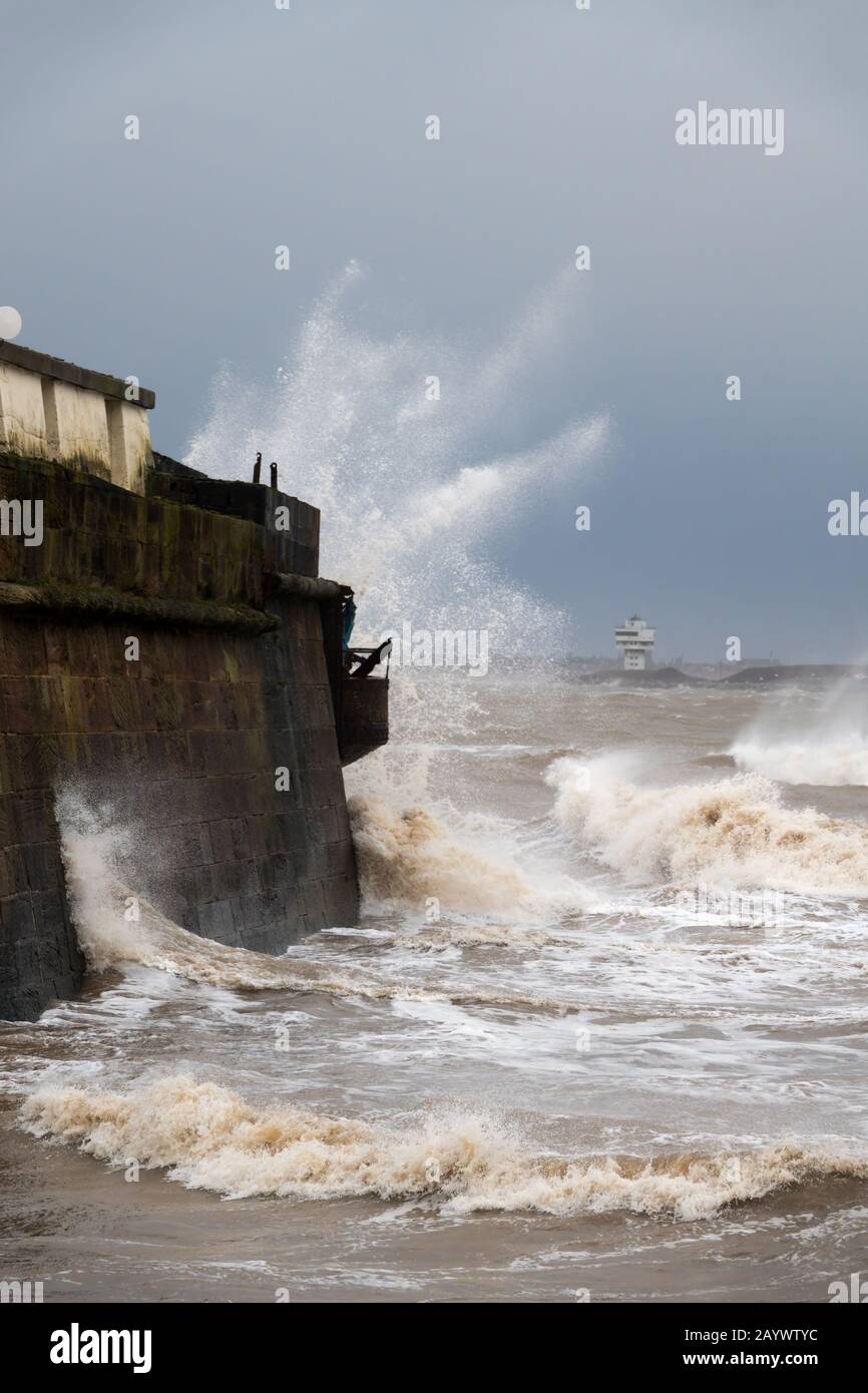 Waves crash into Fort Perch Rock at New Brighton Merseyside during the ...