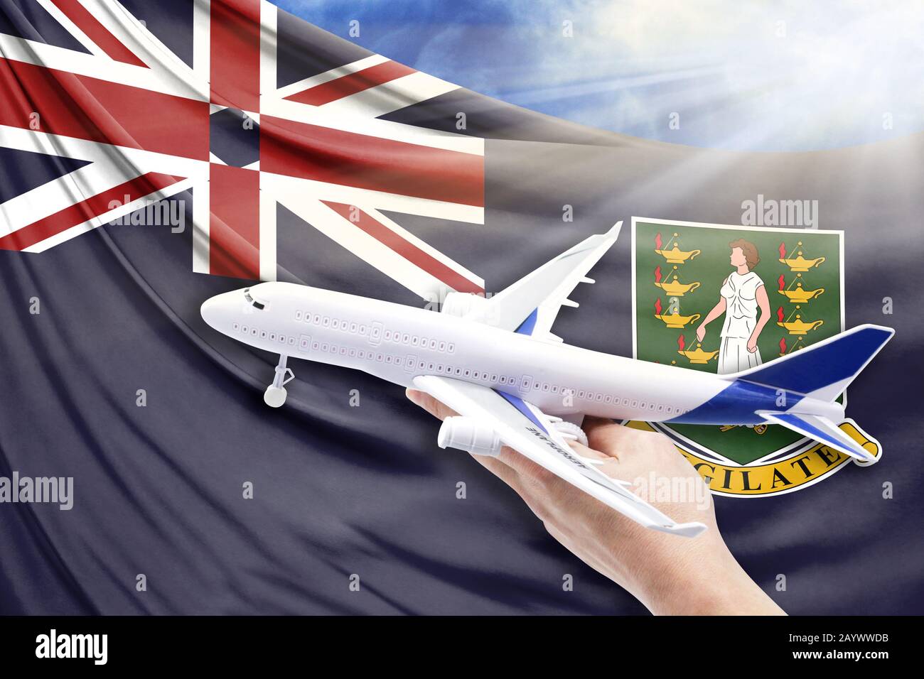 Airplane in hand with national flag of British Virgin Islands on a ...