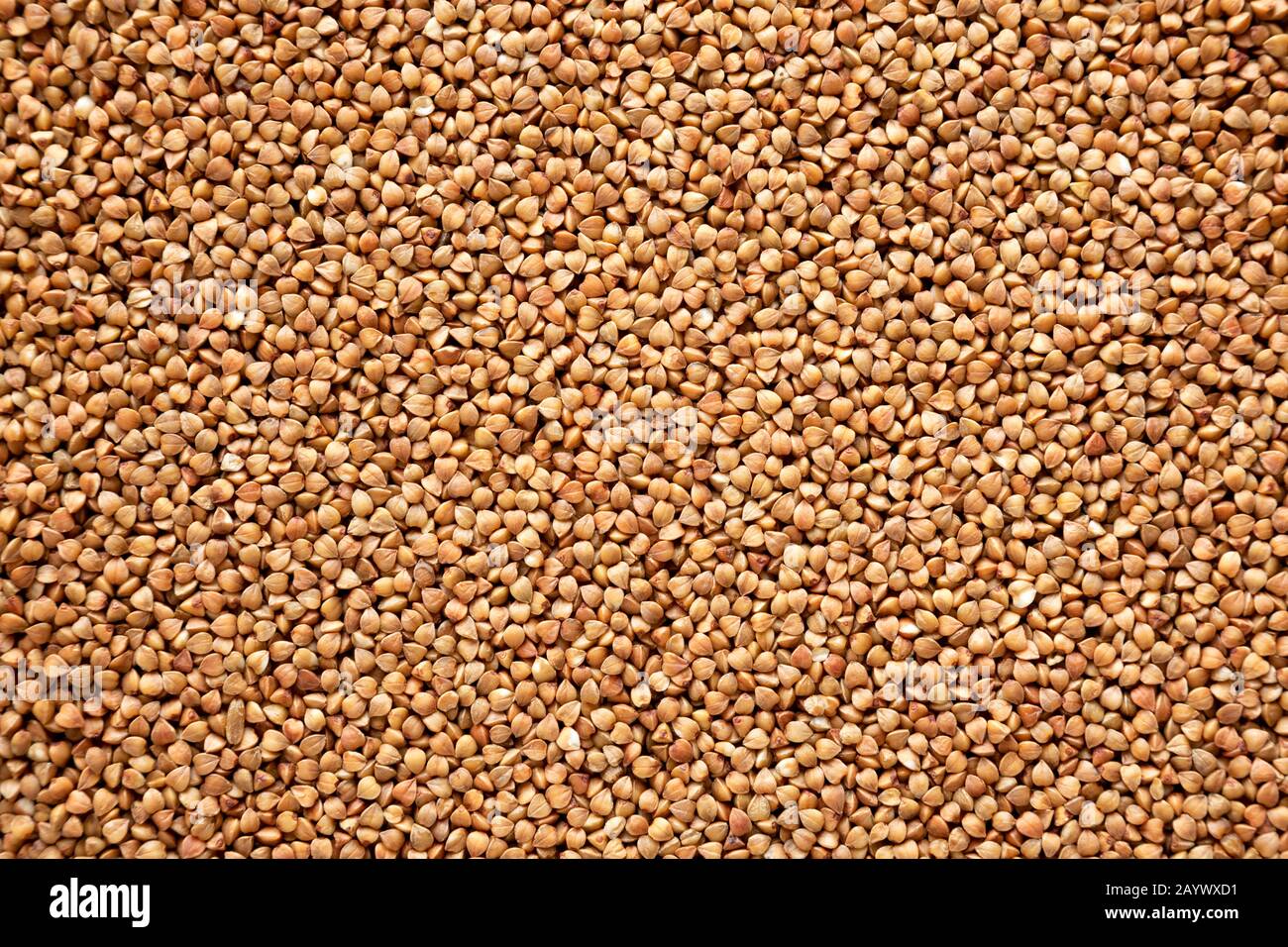 Uncooked Roasted Buckwheat background Stock Photo - Alamy