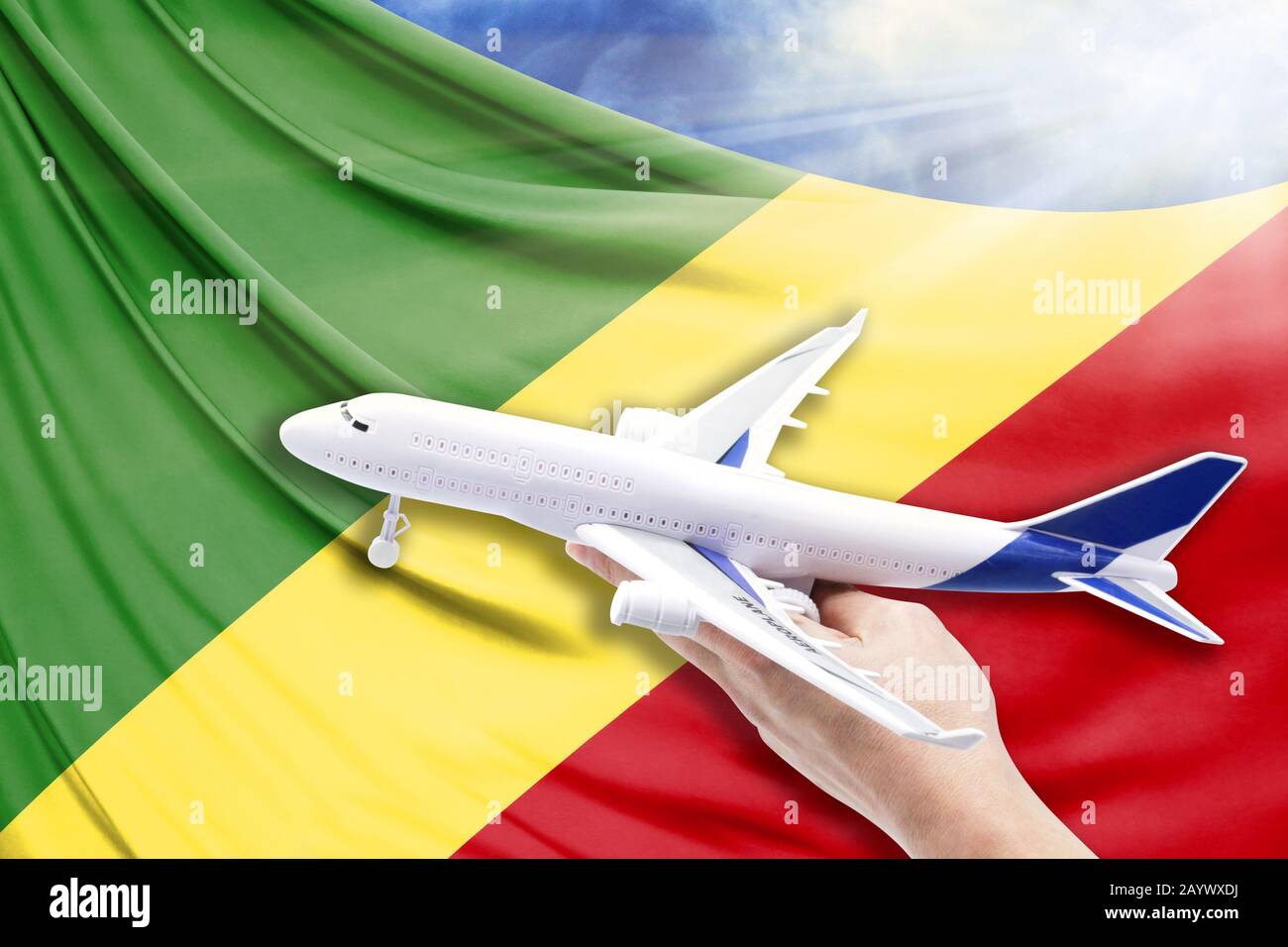 Airplane in hand with national flag of Congo,Republic on a background ...