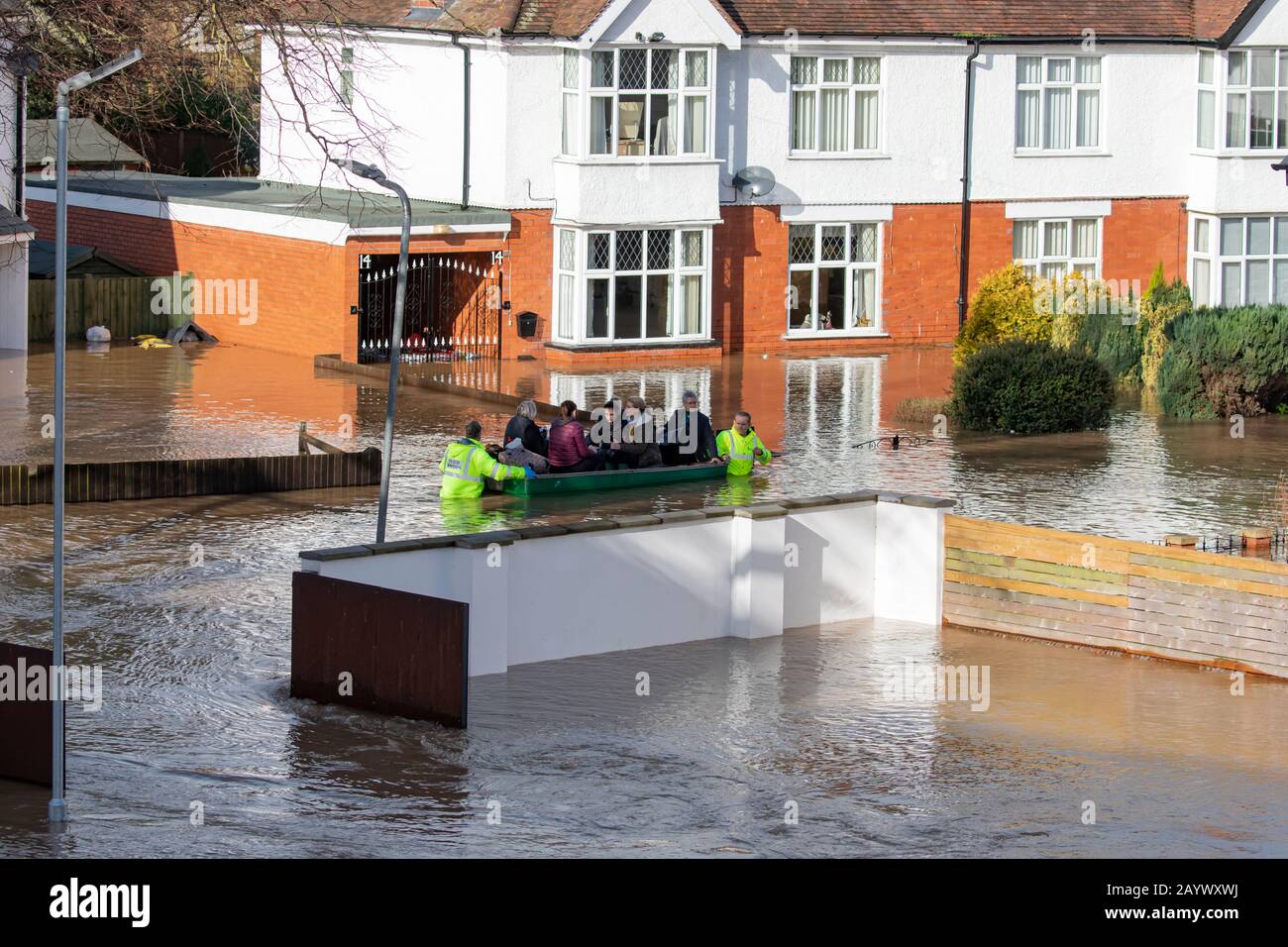 Rescuers evacuating residents by boat after Storm Dennis in Hereford ...