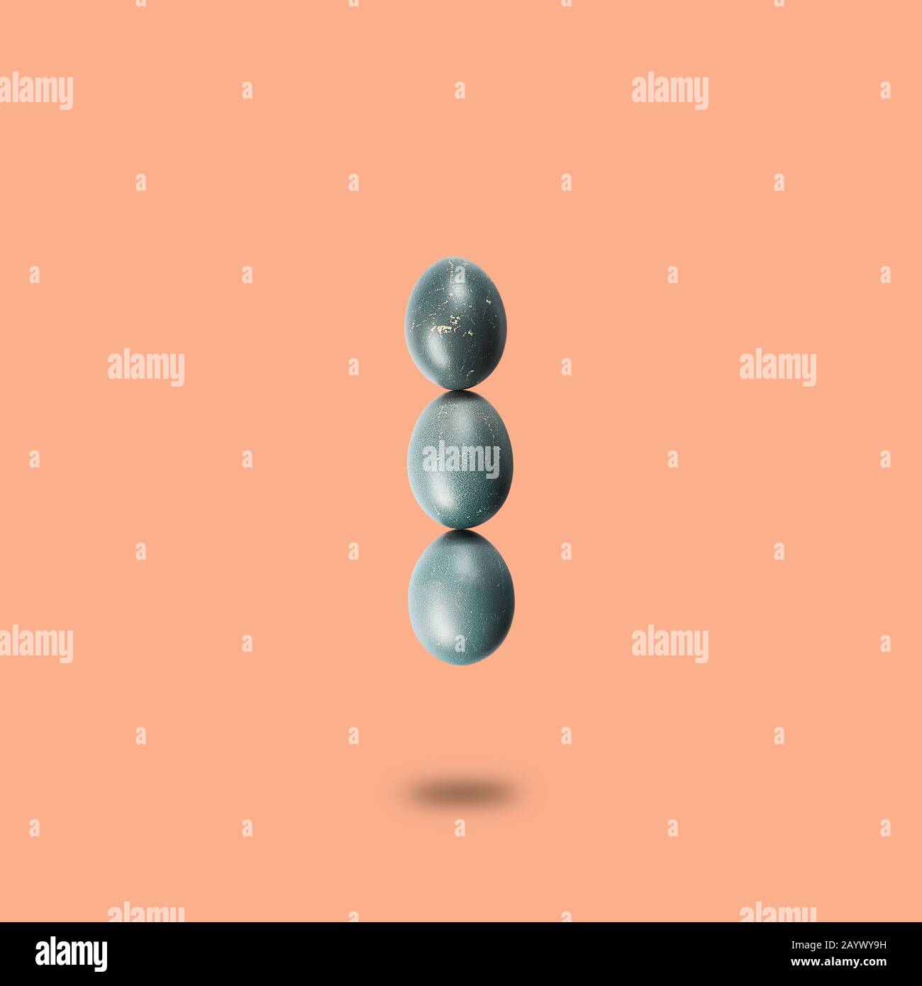 Easter tower from eggs balancing in the air, abstract minimalistic ...