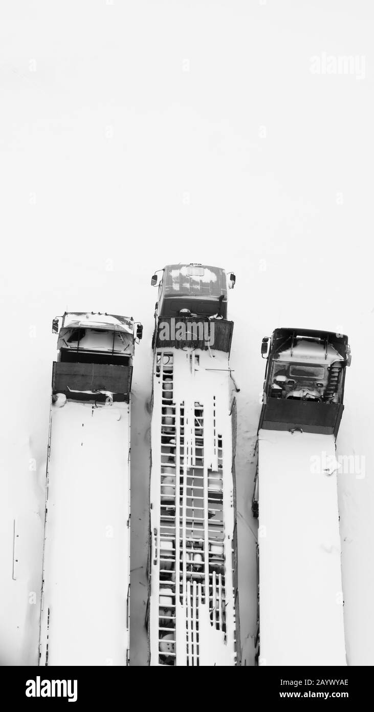 Truck under the snow. lorry covered with snow after snowfall. long ...