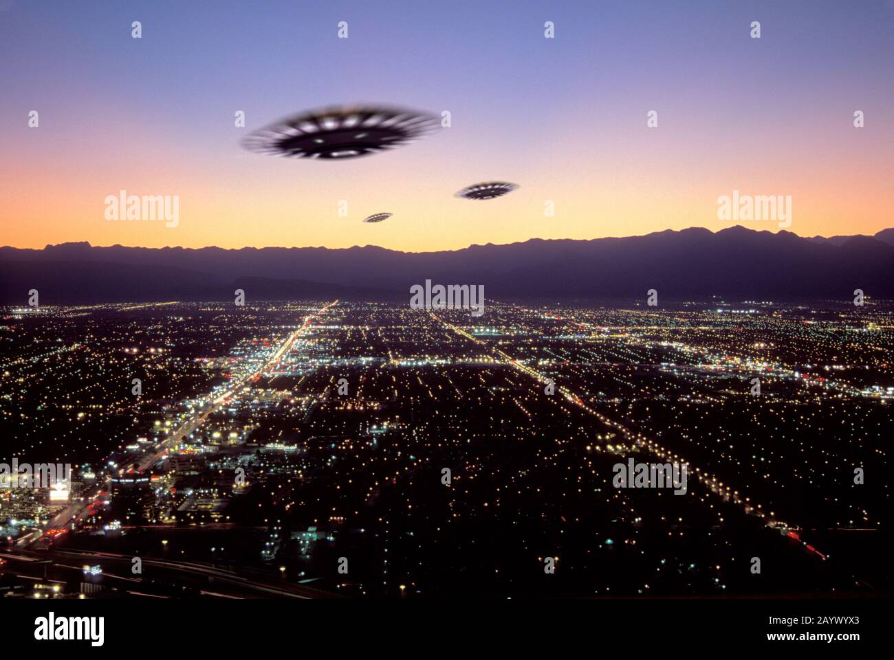 UFO sighting over city at night Stock Photo - Alamy