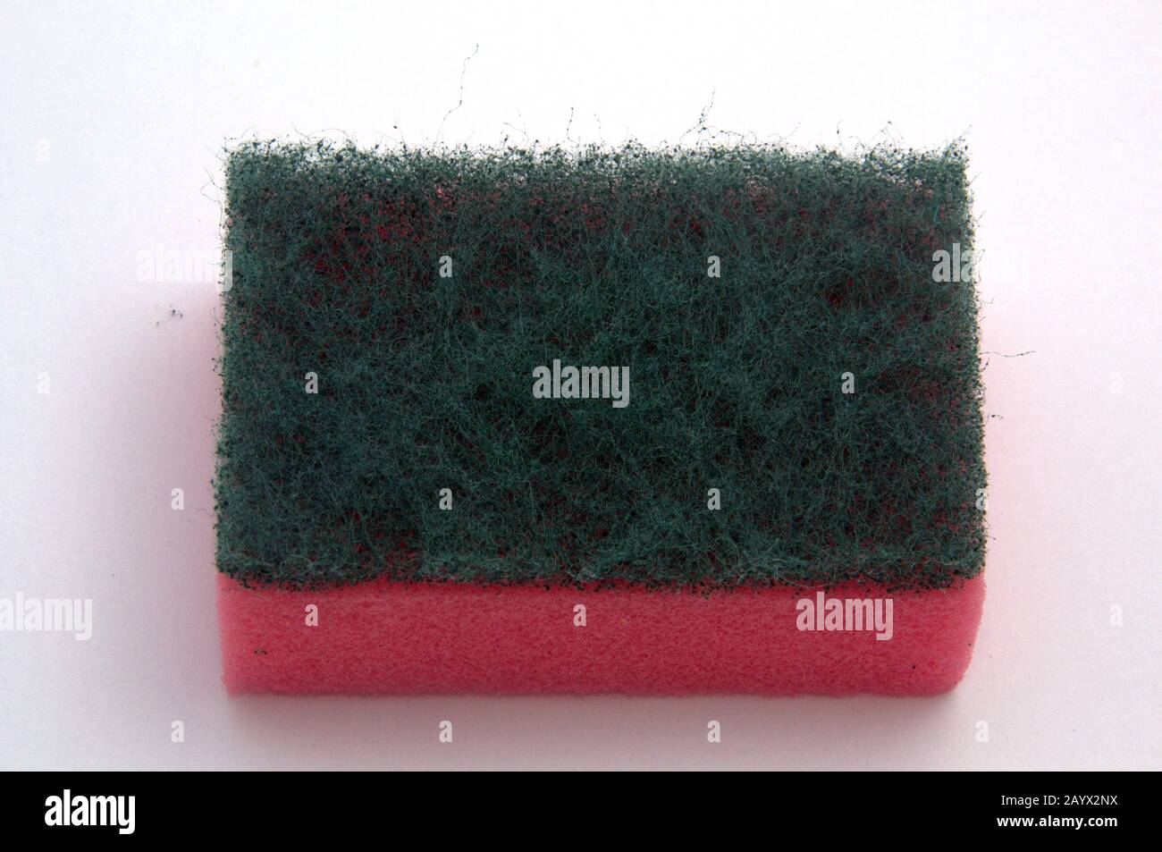 A pan scourer for washing dishes and pans on a white background Stock ...